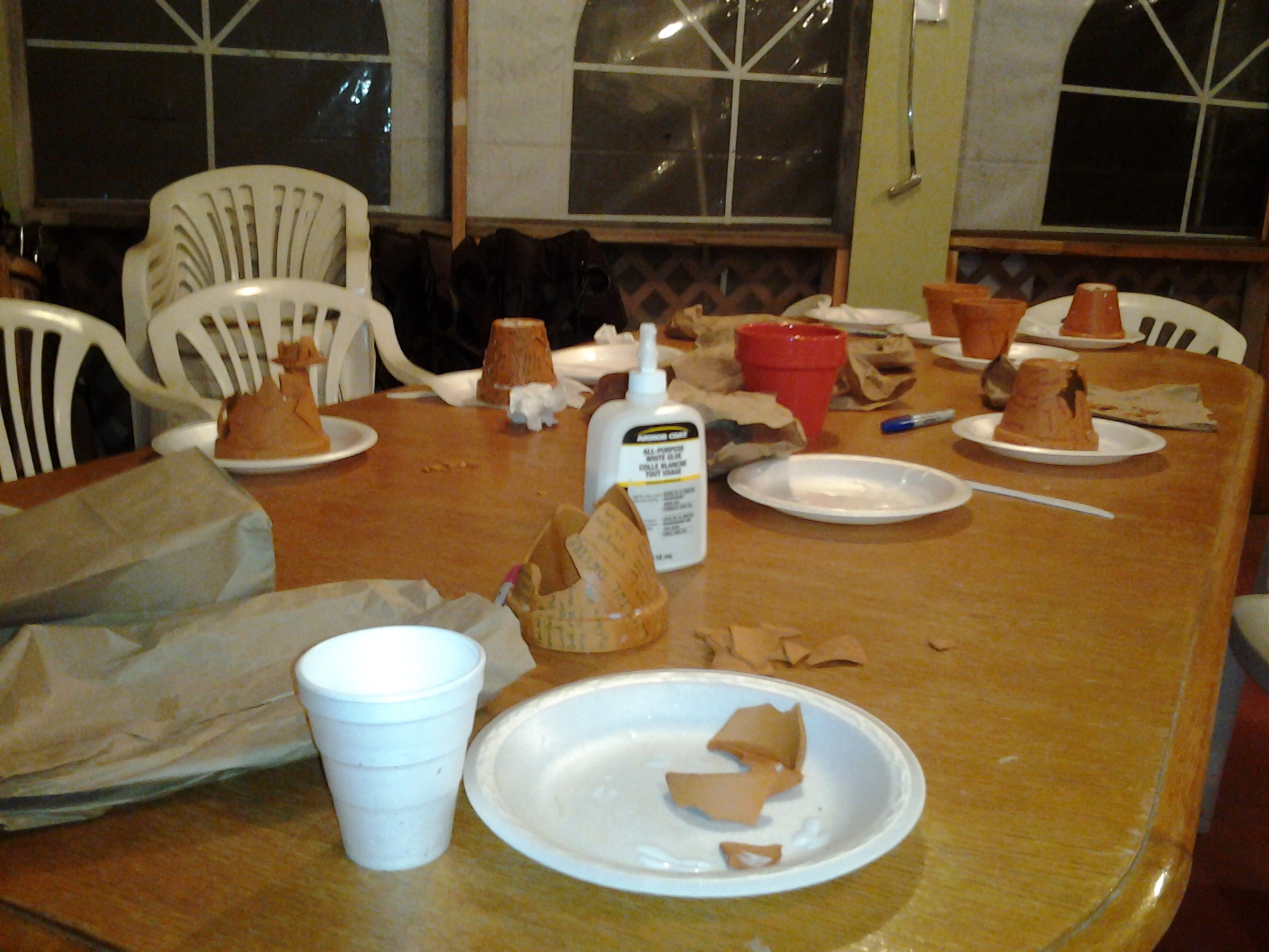 Broken pots holding light – Eric Friesen